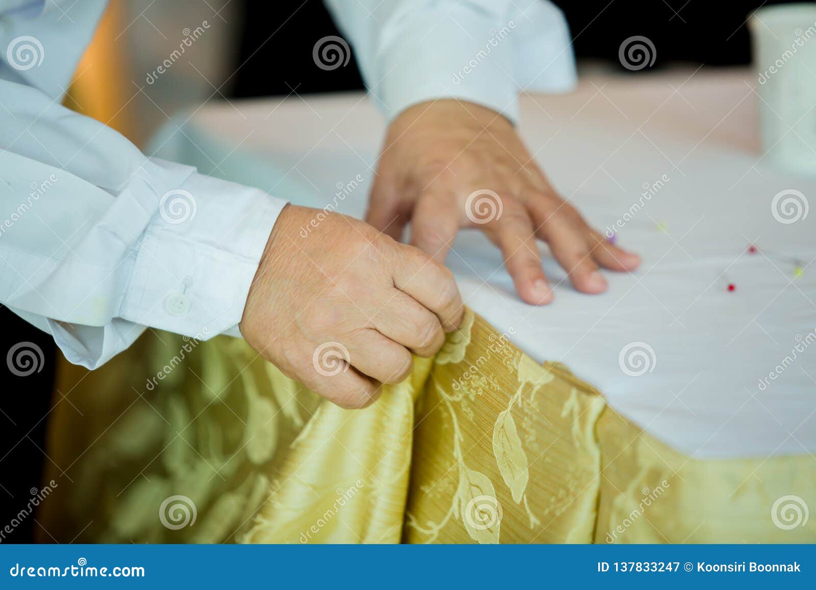 Hands of Staff Preparing the Tablecloth with Pin and Decorations Stock ...