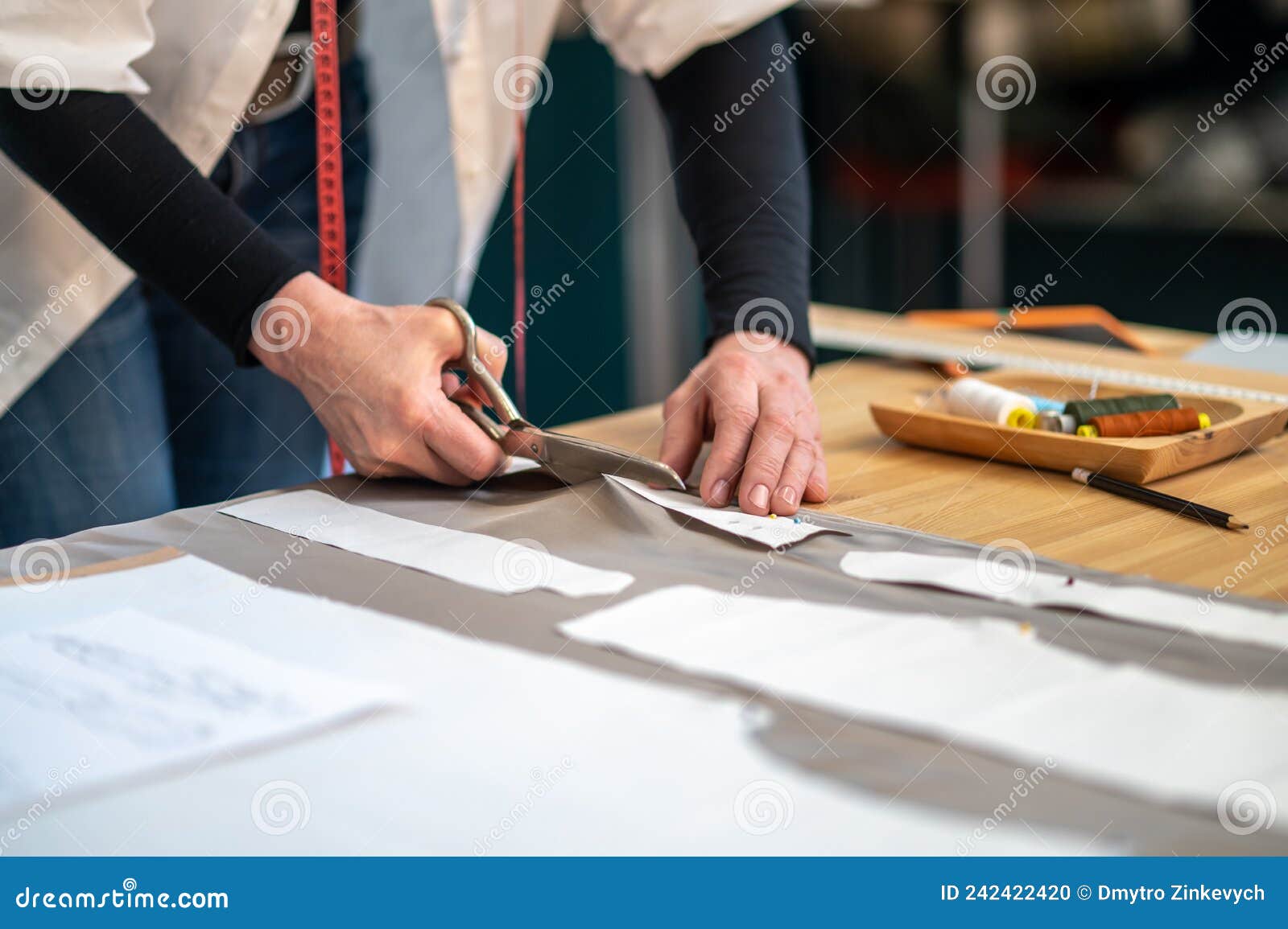 Hands of Tailor with Scissors Cutting Out Pattern Stock Photo - Image ...