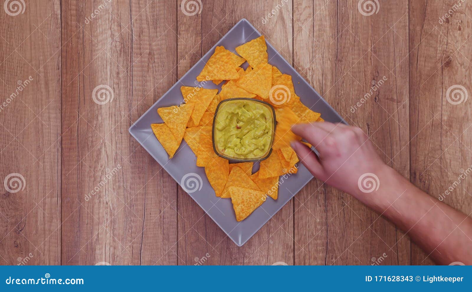 Hands Taking Delicious Tortilla Chips from a Rotating Plate Stock Video ...