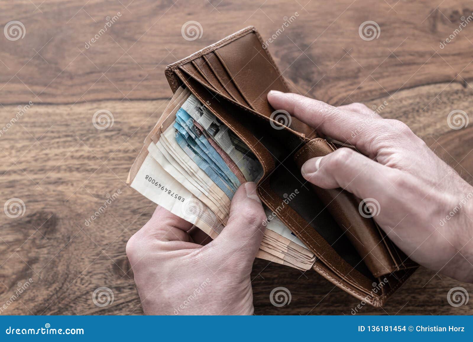 Hands Taking Stack of Cash Out of Wallet Stock Photo - Image of ...