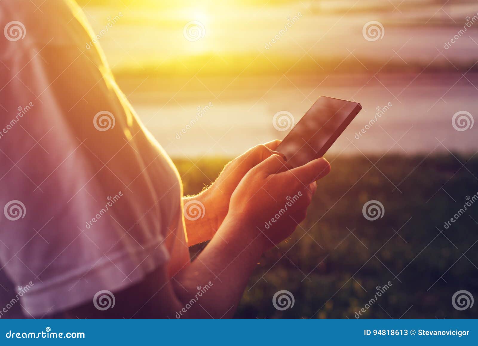 Hands Texting on Mobile Phone in Sunset Stock Image - Image of sunset ...