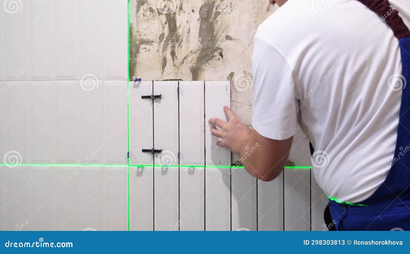 The Hands of the Tiler are Laying the Ceramic Tile on the Wall Stock ...