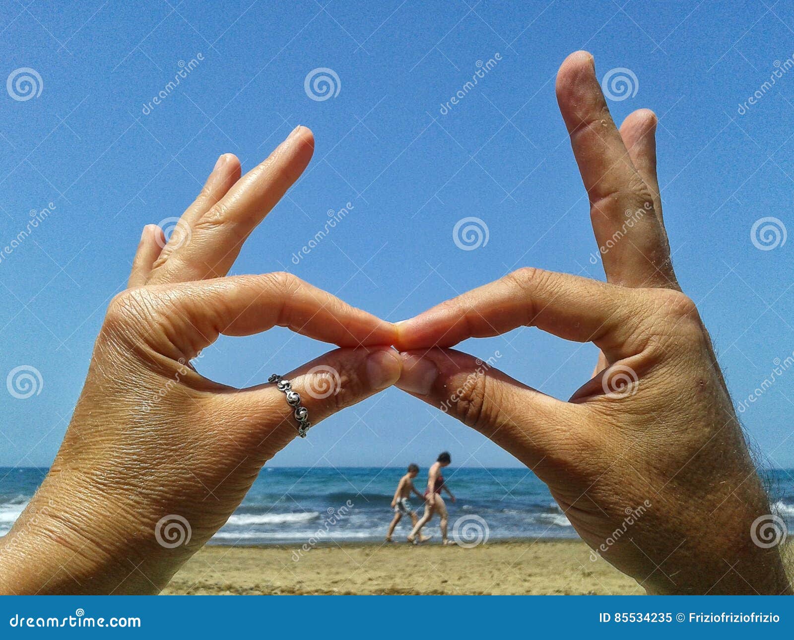 Hands together on the sea stock image. Image of serenity - 85534235