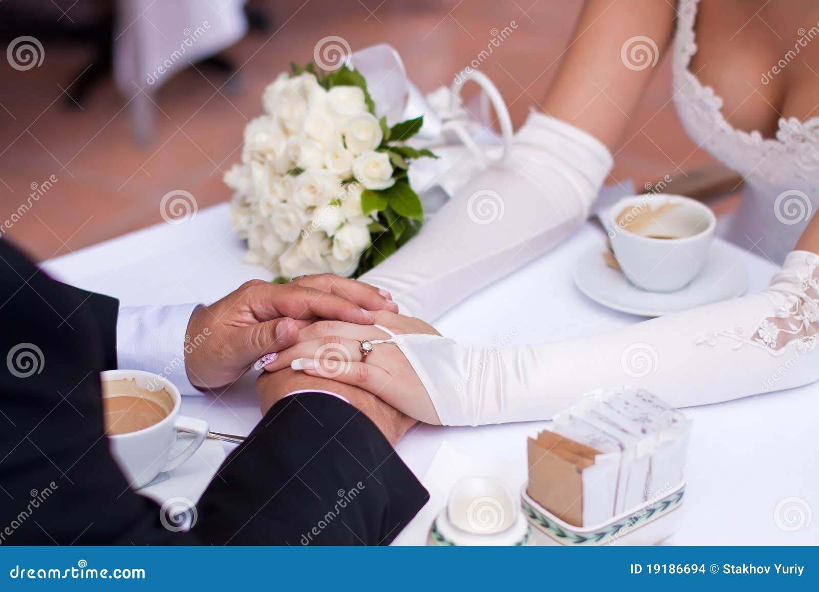 Hands together on a table stock photo. Image of brown - 19186694