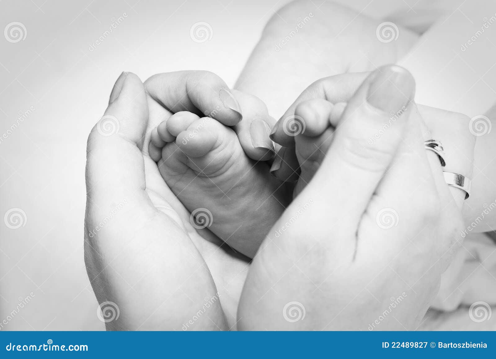 Hands touch child s feet stock image. Image of maternal - 22489827