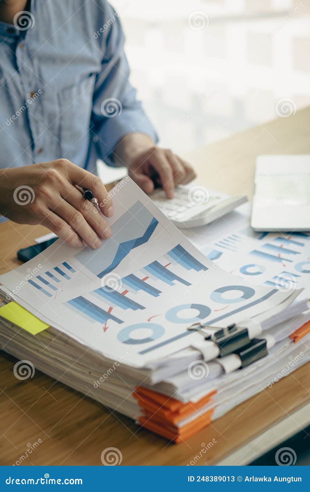 Young Businessman Working in Piles of Paper Files, Searching for ...