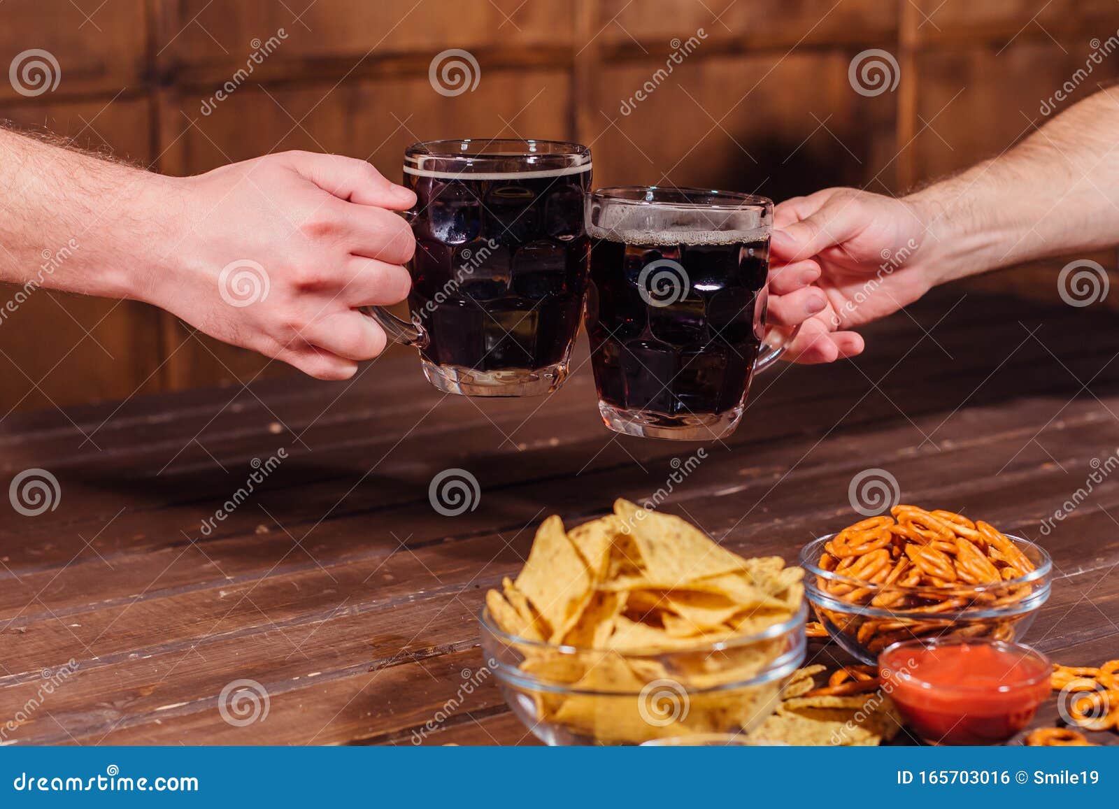 Hands of Two Men Holding Beer Glasses Drinking Beer Together Stock ...