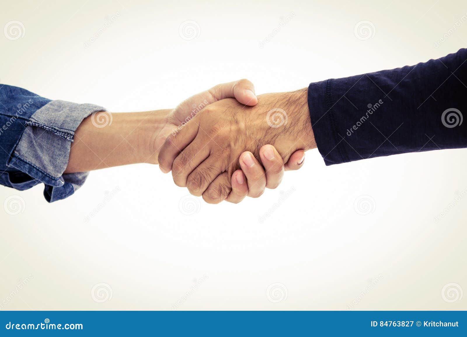 Hands of Two Men Wearing Casual Clothes Making Handshake Stock Image ...