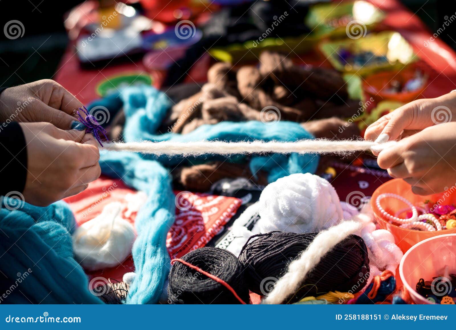 Hands of Two People Holding a Thread for Knitting Stock Image - Image ...