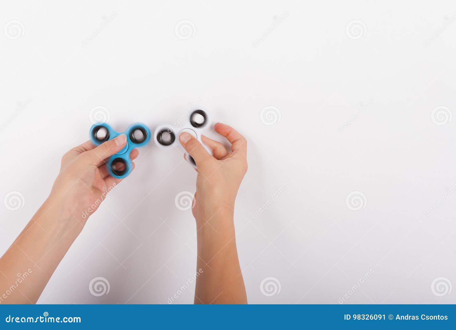 Hands with Two Spinning Fidget Spinners Stock Image - Image of gadget ...