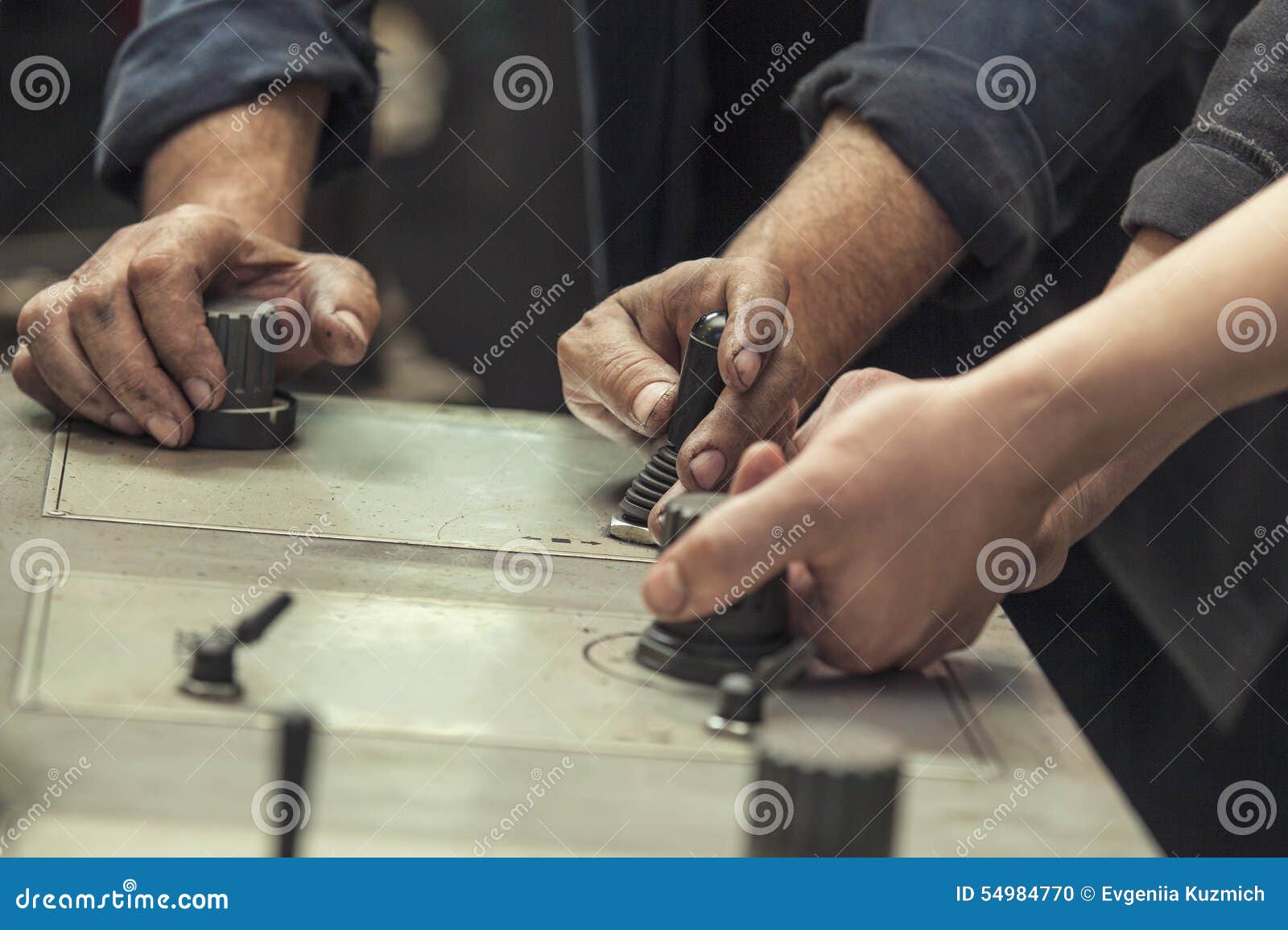 The Hands of the Two Working Switch Levers and Knobs Stock Photo ...