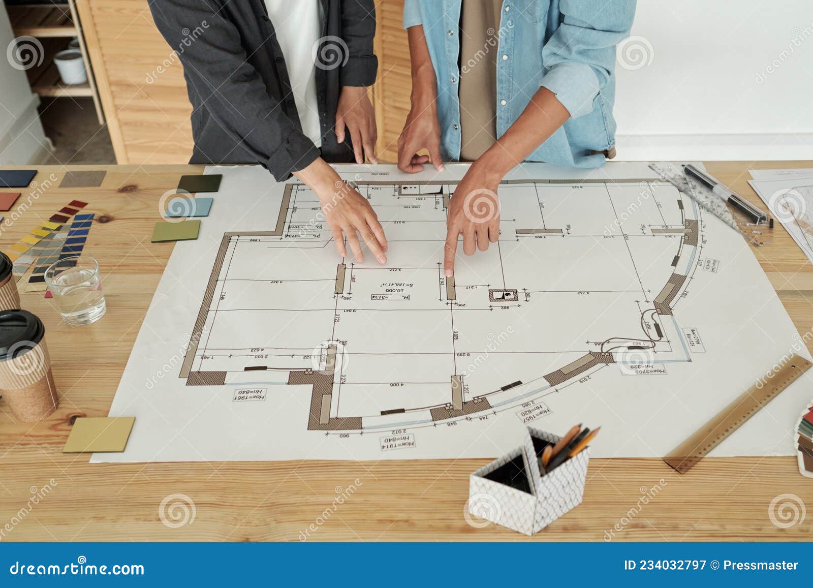 Hands of Two Young Architects Pointing at Sketch on Table Stock Image ...