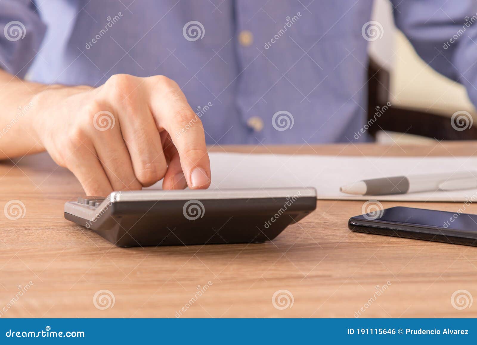 Hands typing calculator stock photo. Image of paperwork - 191115646
