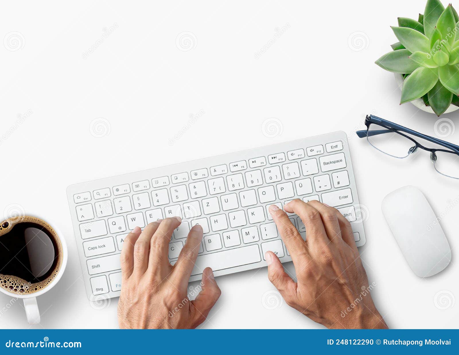 Hands Typing on Computer Keyboard Over White Office Desk Table with Cup ...