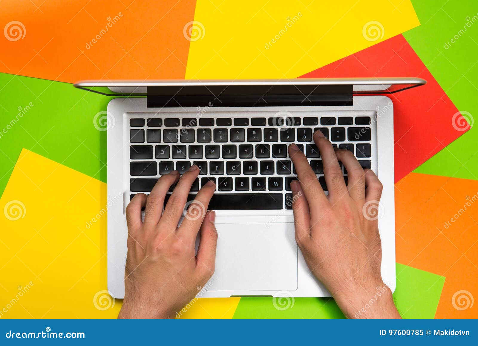 Hands Typing on Laptop on Colorful Paper. Top View Flat Lay Stock Image ...