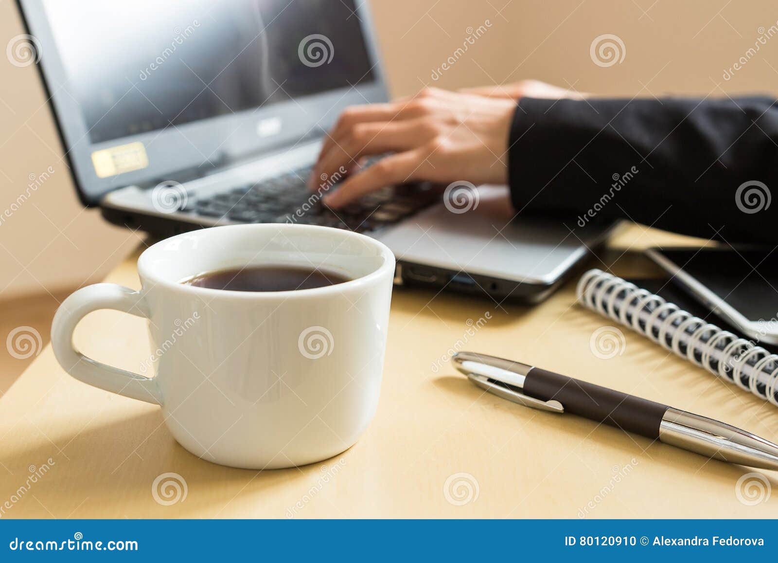 Hands Typing on a Laptop. Cup of Coffee, Smartphone and Laptop on the ...