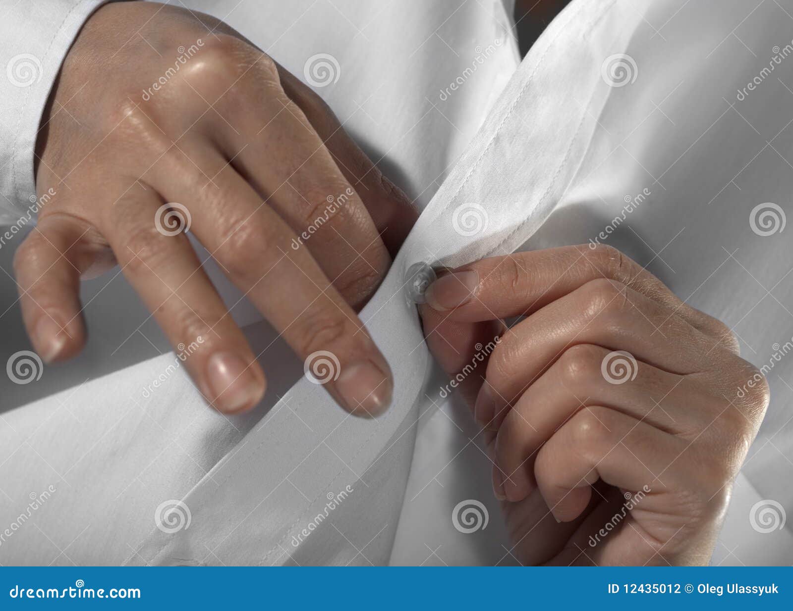 Hands unbutton a button stock photo. Image of sensitive - 12435012