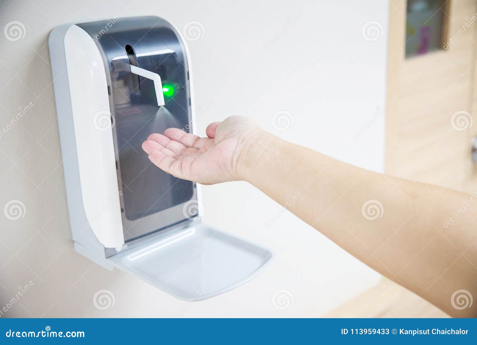 Hands Under the Automatic Alcohol Dispenser. Stock Image - Image of ...