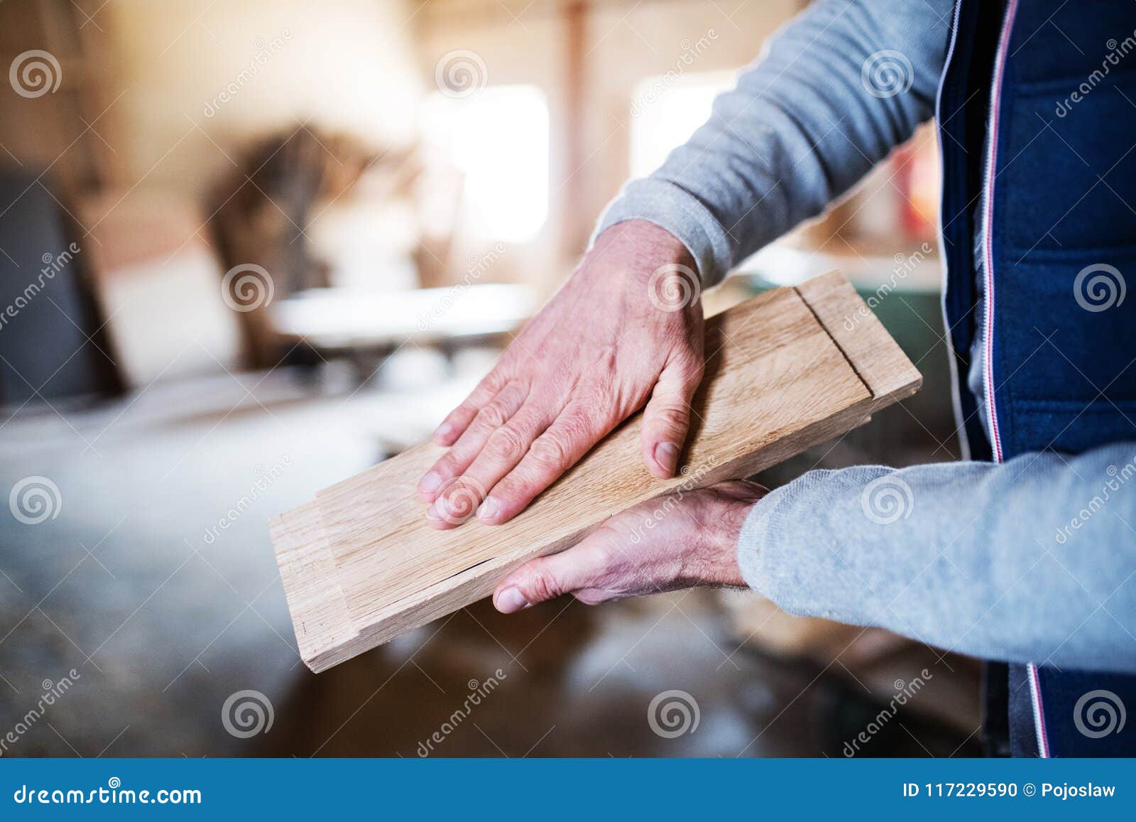 An Unrecognizable Man Worker in the Carpentry Workshop, Working with ...