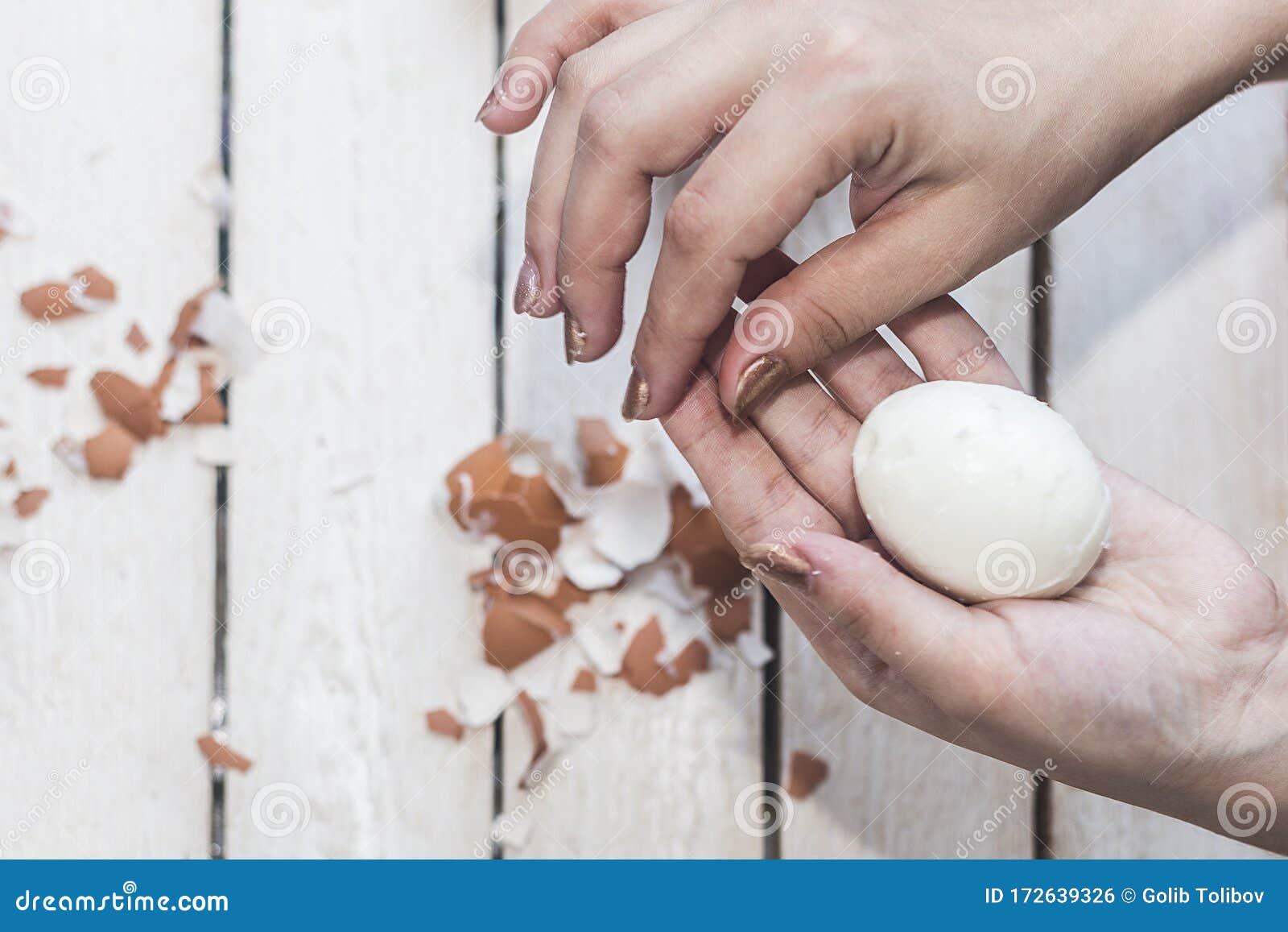 Woman Cleaning Boiled Eggs from the Shell Stock Photo - Image of cooked ...