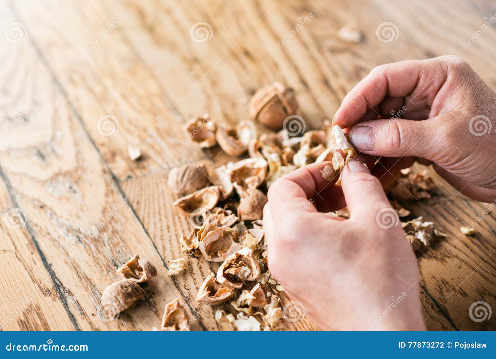 Hands of Unrecognizable Woman Cracking Walnuts, Wooden Table Stock ...