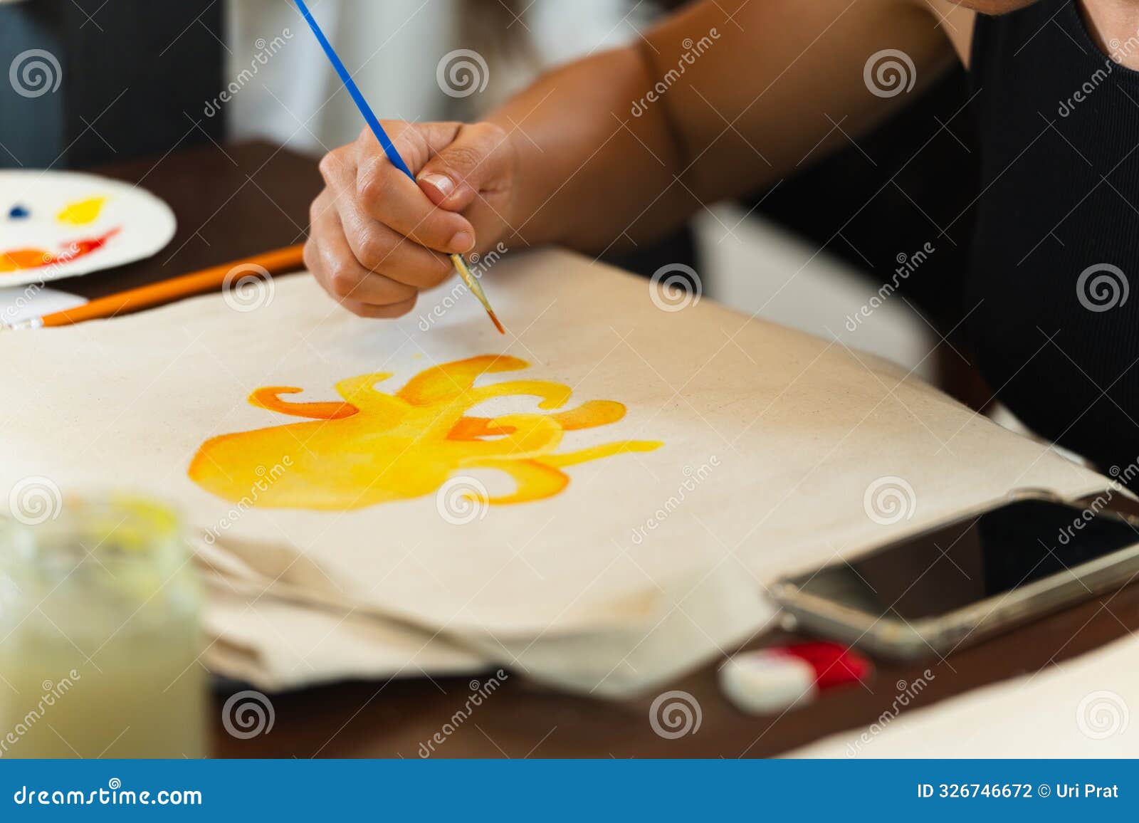 Hands of an Unrecognizable Woman Drawing a Yellow and Orange Octopus ...