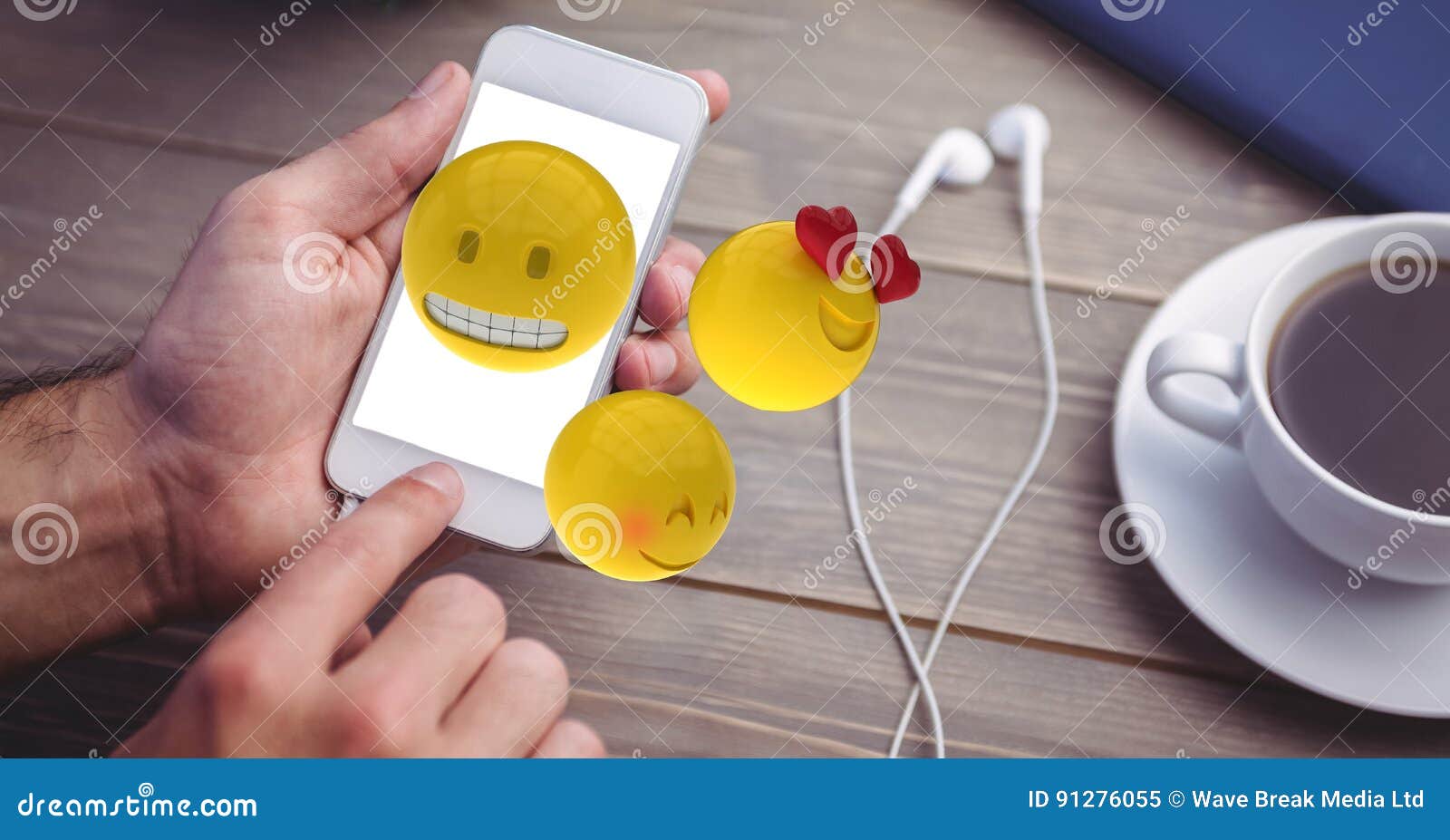 Hands Using Emojis on Smart Phone by Earphones and Coffee Cup on Table ...