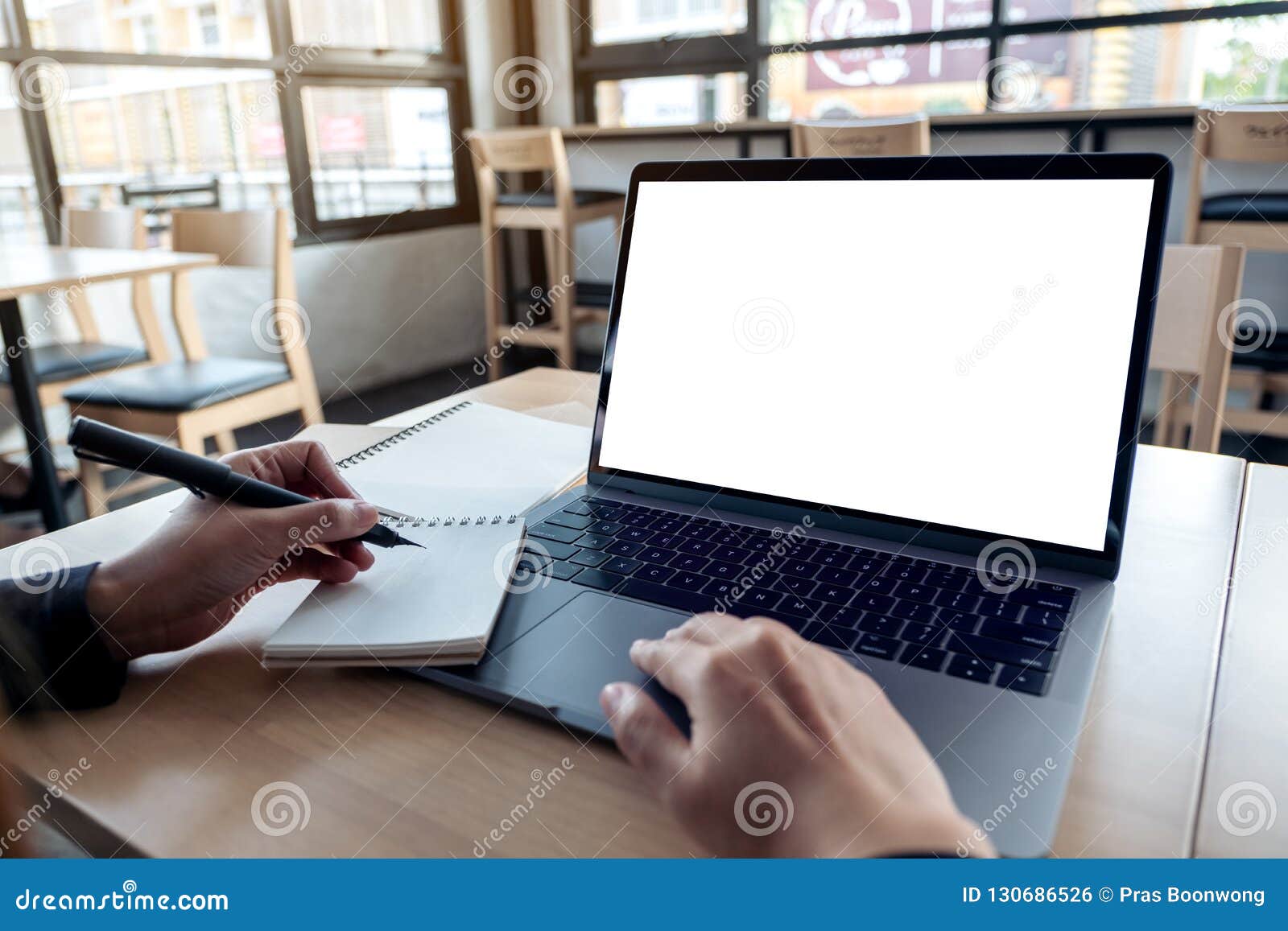 Hands Using Laptop with Blank White Desktop Screen while Writing on a ...