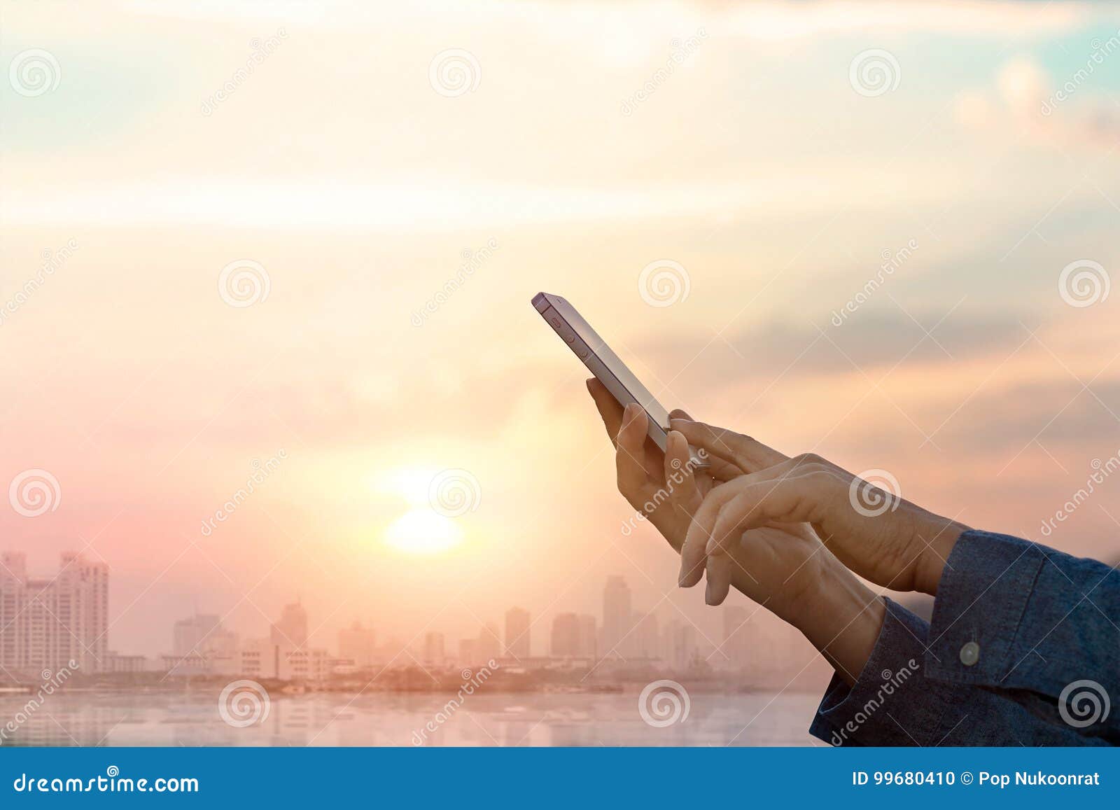 Hands Using Smartphone on City Sunset Background Stock Photo - Image of ...
