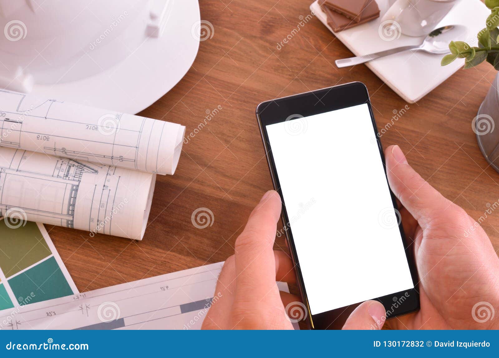 Hands Using Smartphone on the Desk of a Builder`s Office Stock Photo ...