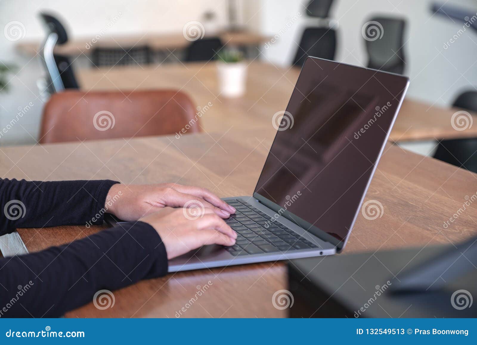 Hands Using and Typing on Laptop Keyboard on Wooden Table in Office ...