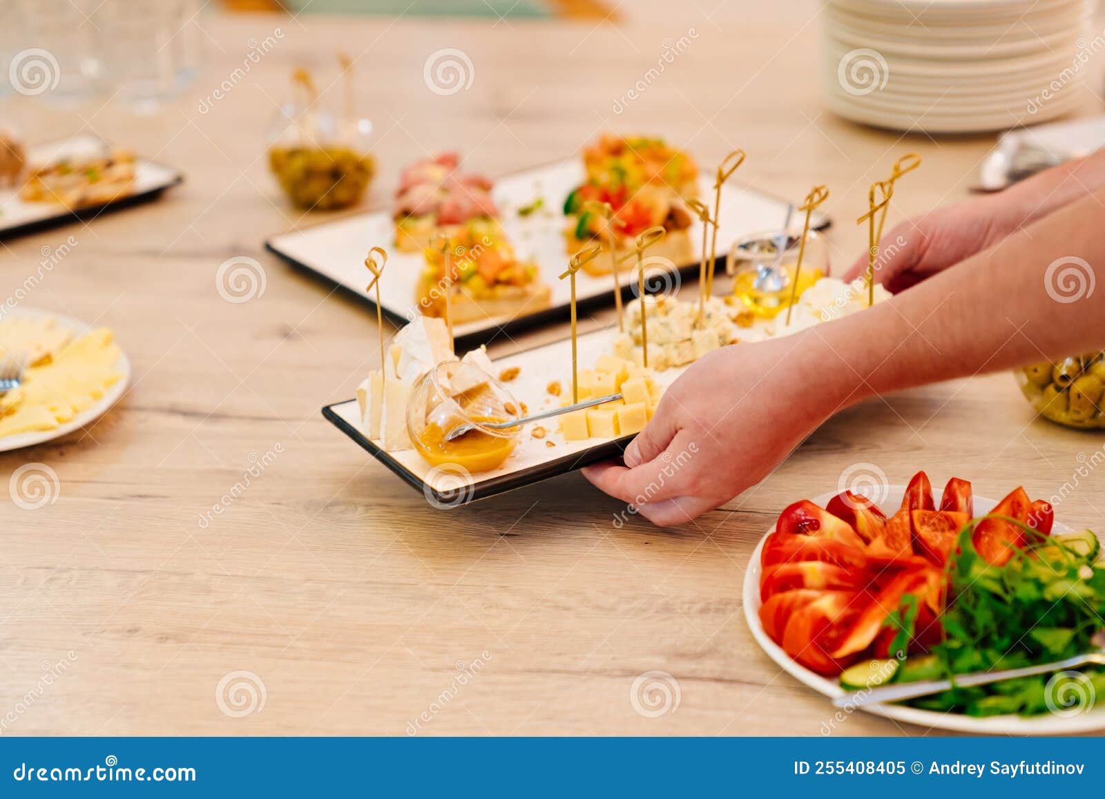Hands of a Waiter with a Plate. Catering for the Holiday. Buffet Menu ...