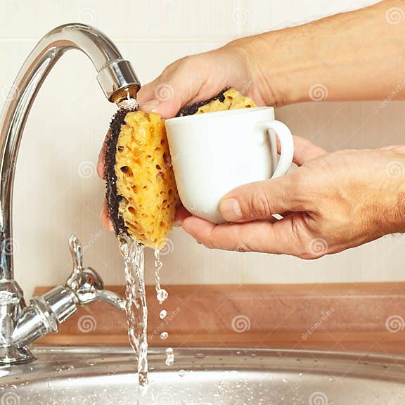 Hands Wash the Coffee Cup Under Running Water in Kitchen Stock Photo ...