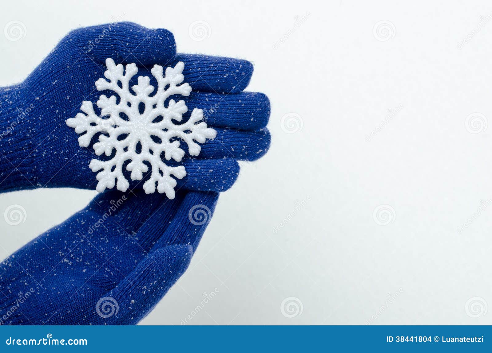 Hands Wearing Blue Gloves Holding a Big Snowflake. Stock Photo - Image ...