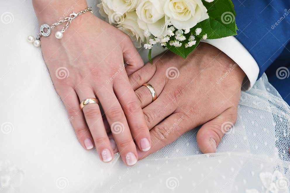 Hands with wedding rings stock photo. Image of bridegroom - 49719536