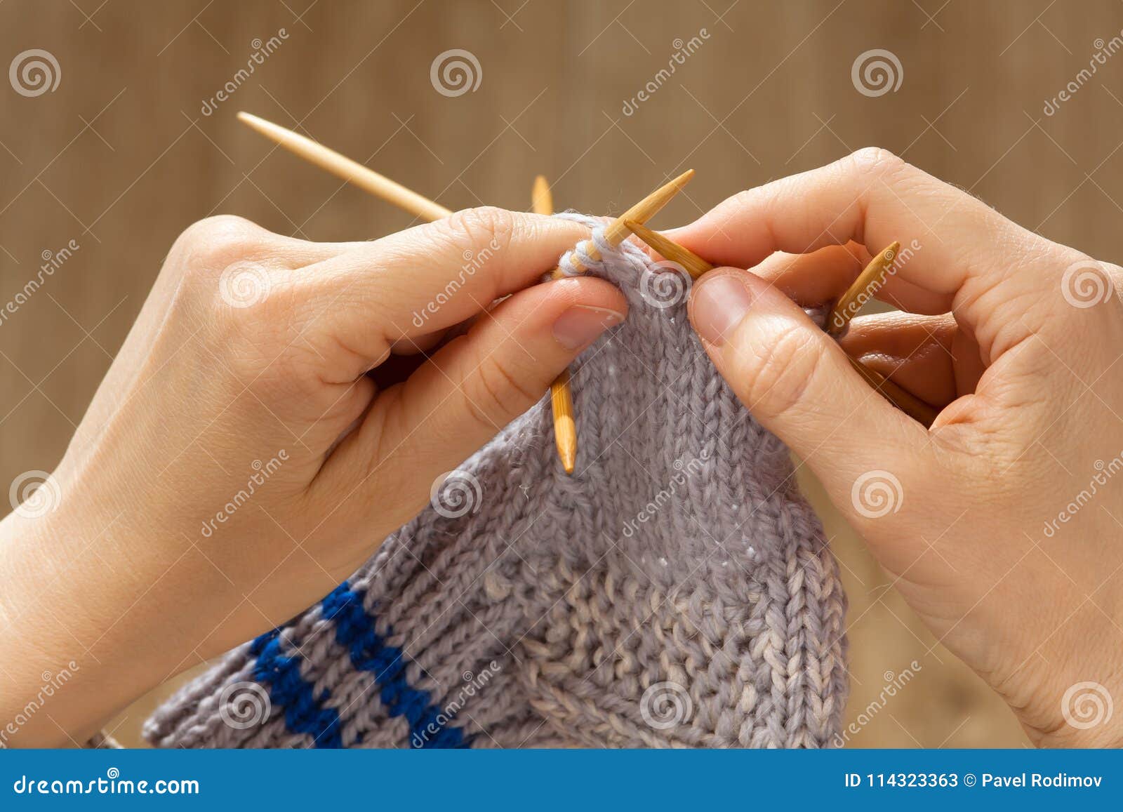 Hands knitting a sock stock image. Image of homemade - 114323363