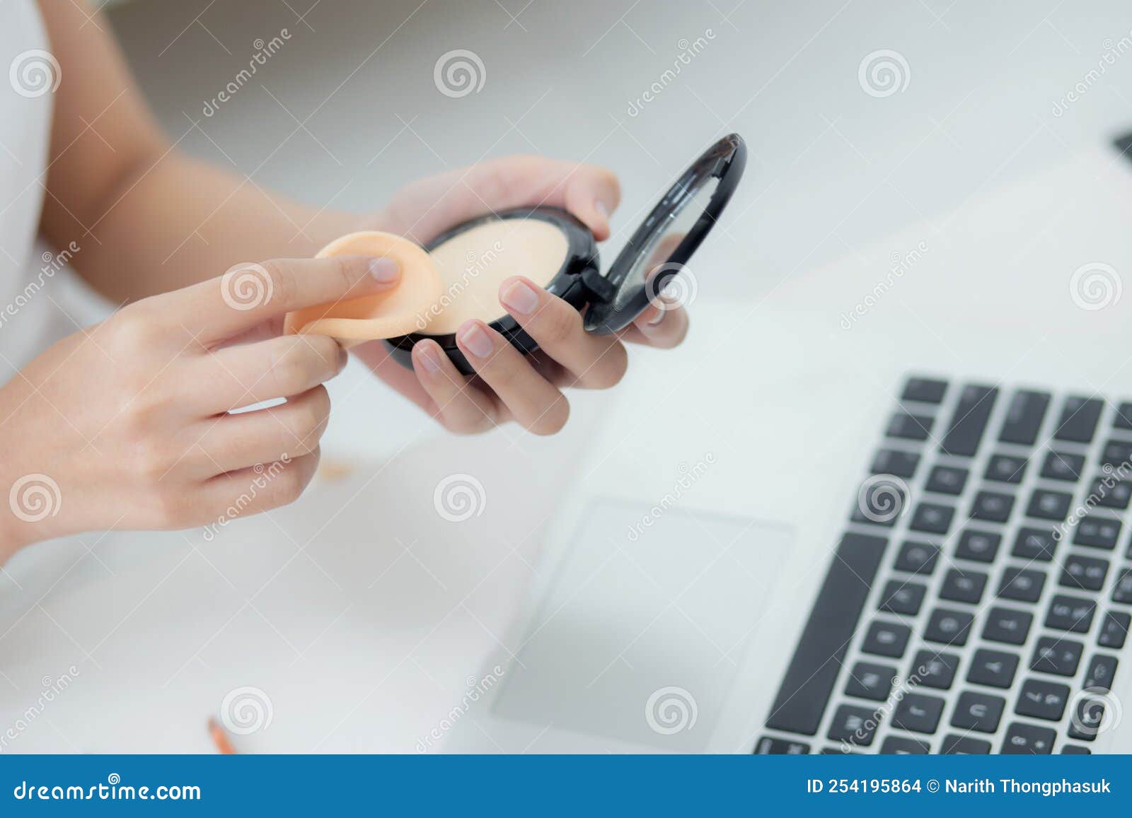 Hands of Woman with Learning Makeup with Powder Puff on Cheek Watching ...