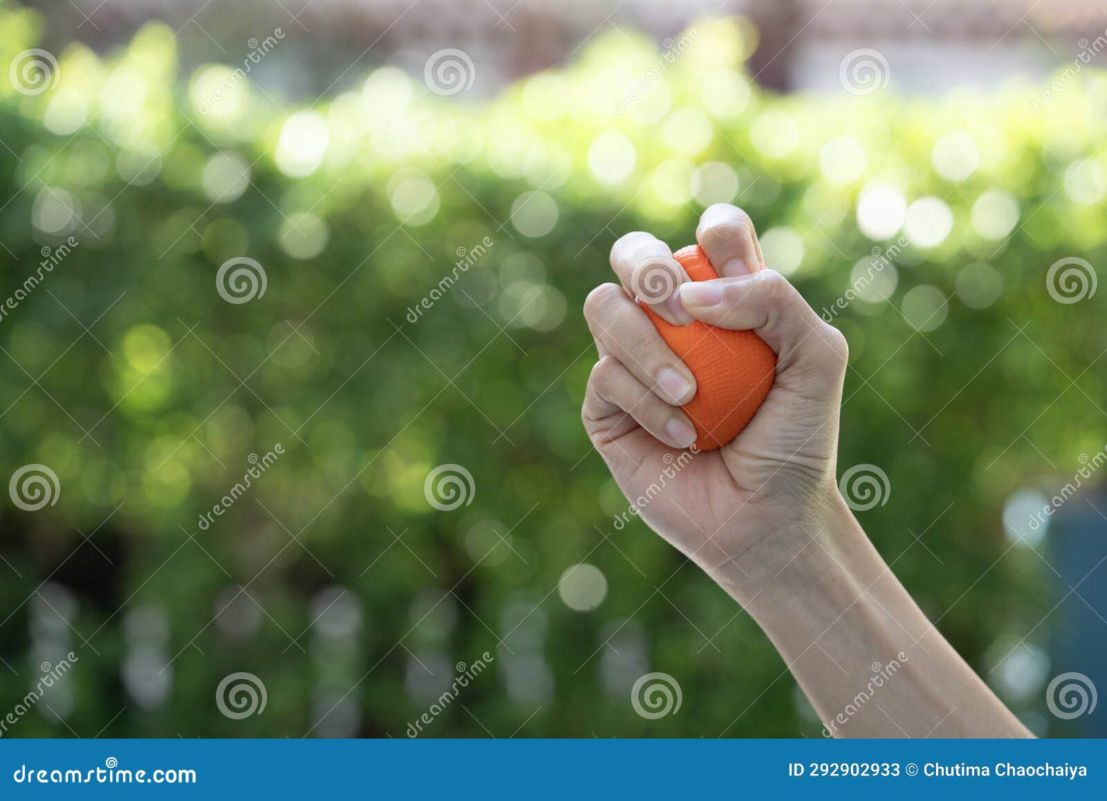 Hands of a Woman Squeezing a Stress Ball, Stress or Exercise Concept ...