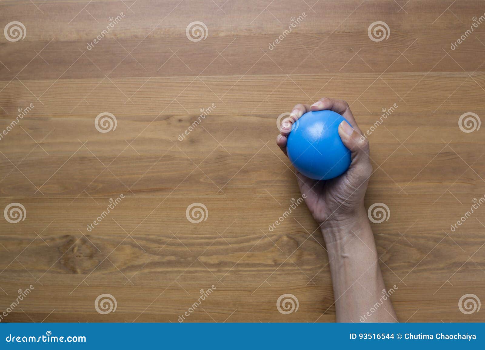 Hands of a Woman Squeezing a Stress Ball on the Table Stock Photo ...