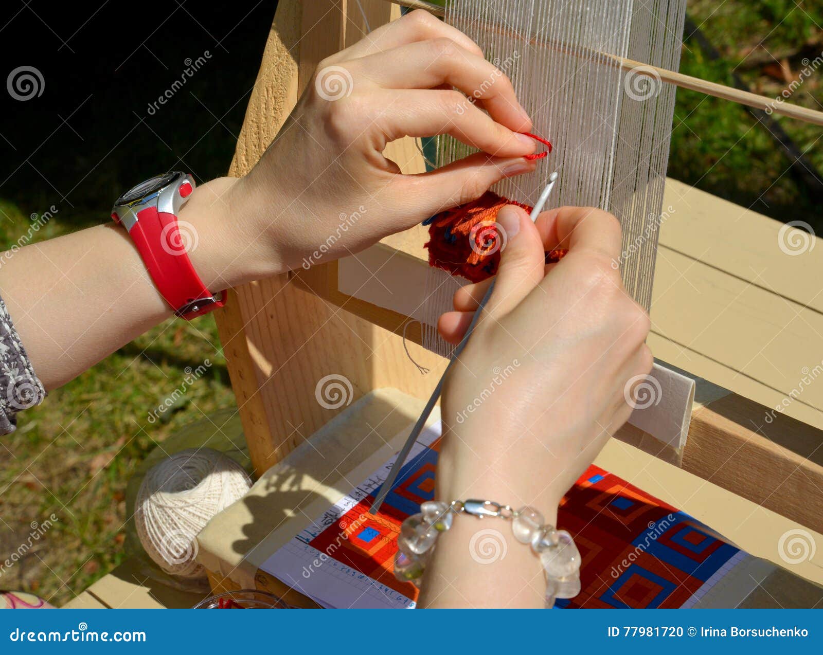 Hands of the Woman Working at the Tiny Weaving Loom. Fair of Nat Stock ...