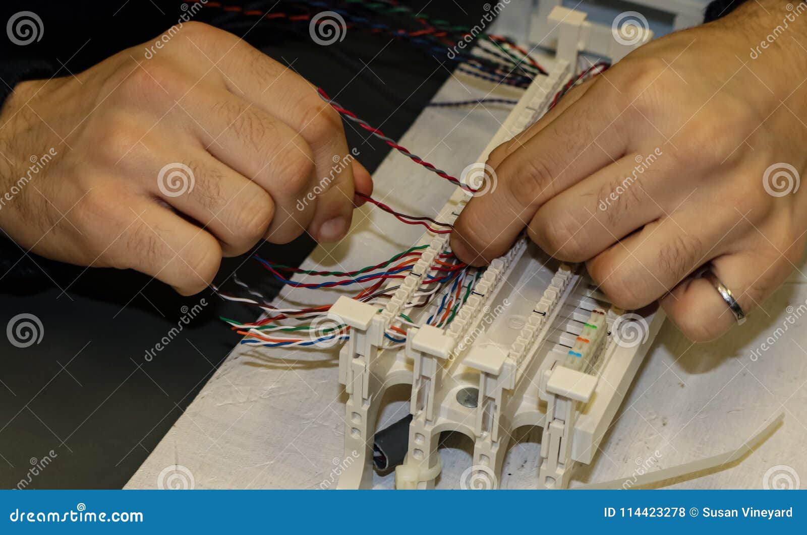 Hands at Work in Network Cabling Practice in an Information Technology ...