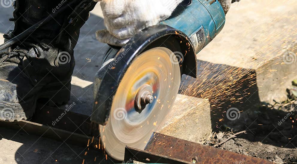 Hands Worker Cuts a Metal Part Using Tool Grinders and Flying a Stock ...