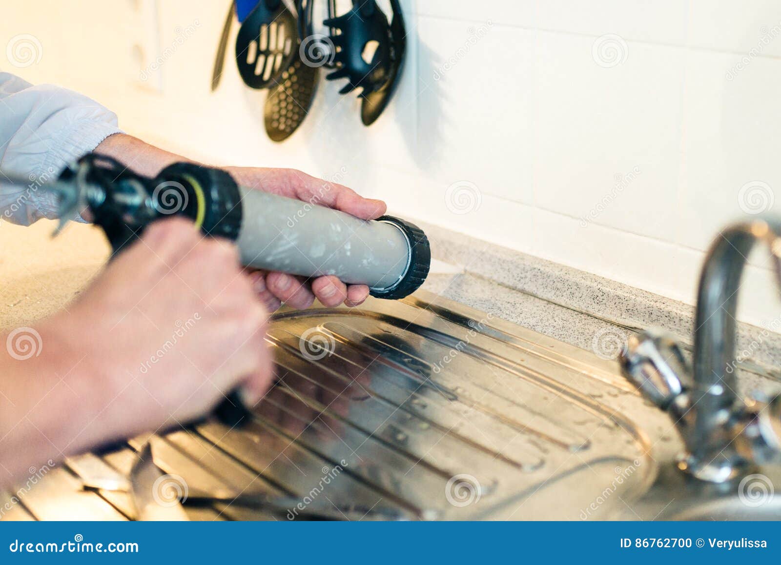 Hands of Worker Using a Silicone Tube for Repairing in the Kitc Stock ...