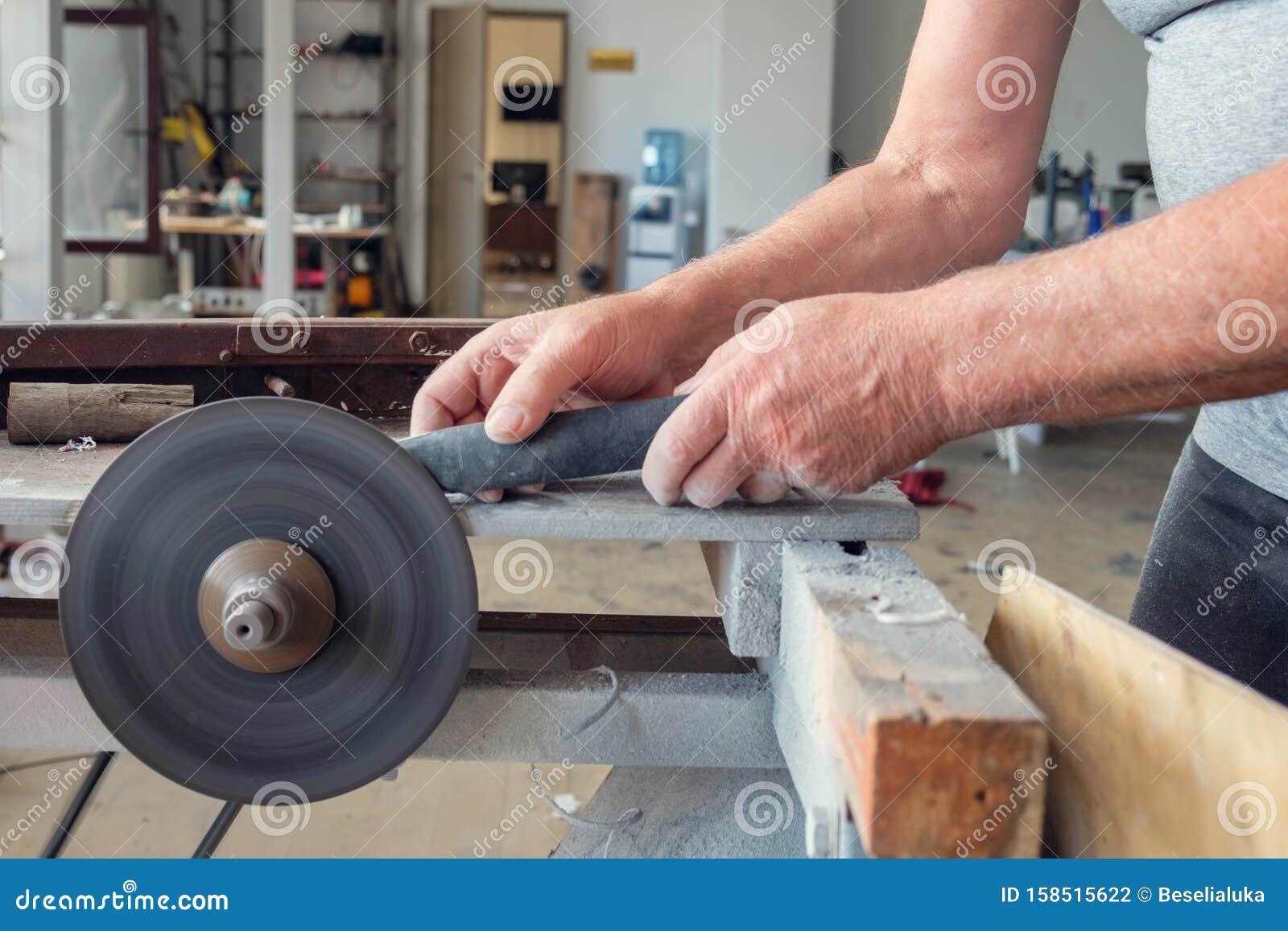 Hands of Worker Wich is Sharpering Knife on Grindstone Stock Photo ...