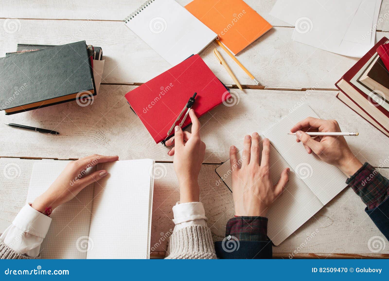 Hands Writing on Desk with Supplies, Student Pov Stock Photo - Image of ...