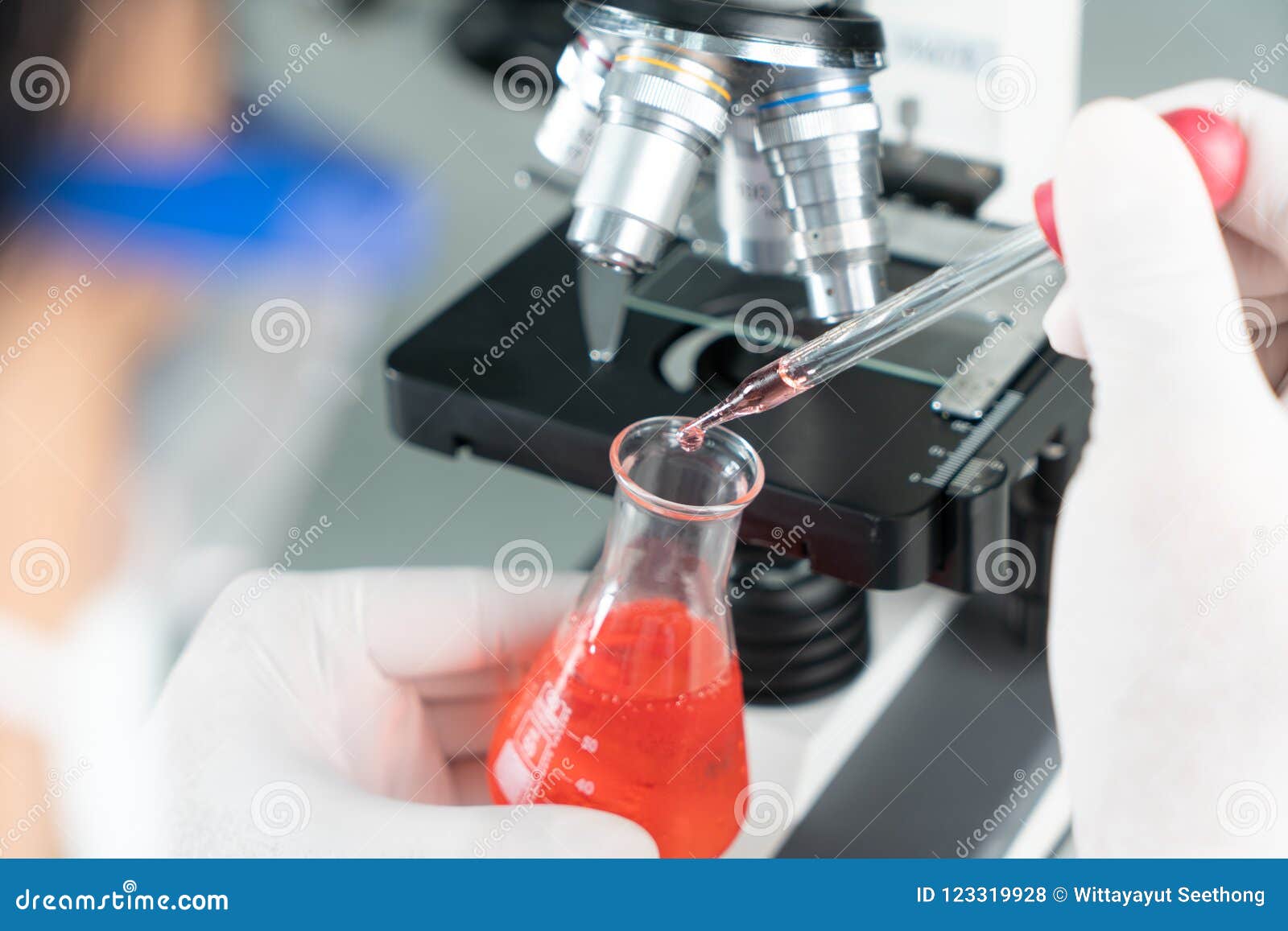 Hands of Young Asian Man and White Microscope in Science Laboratory ...