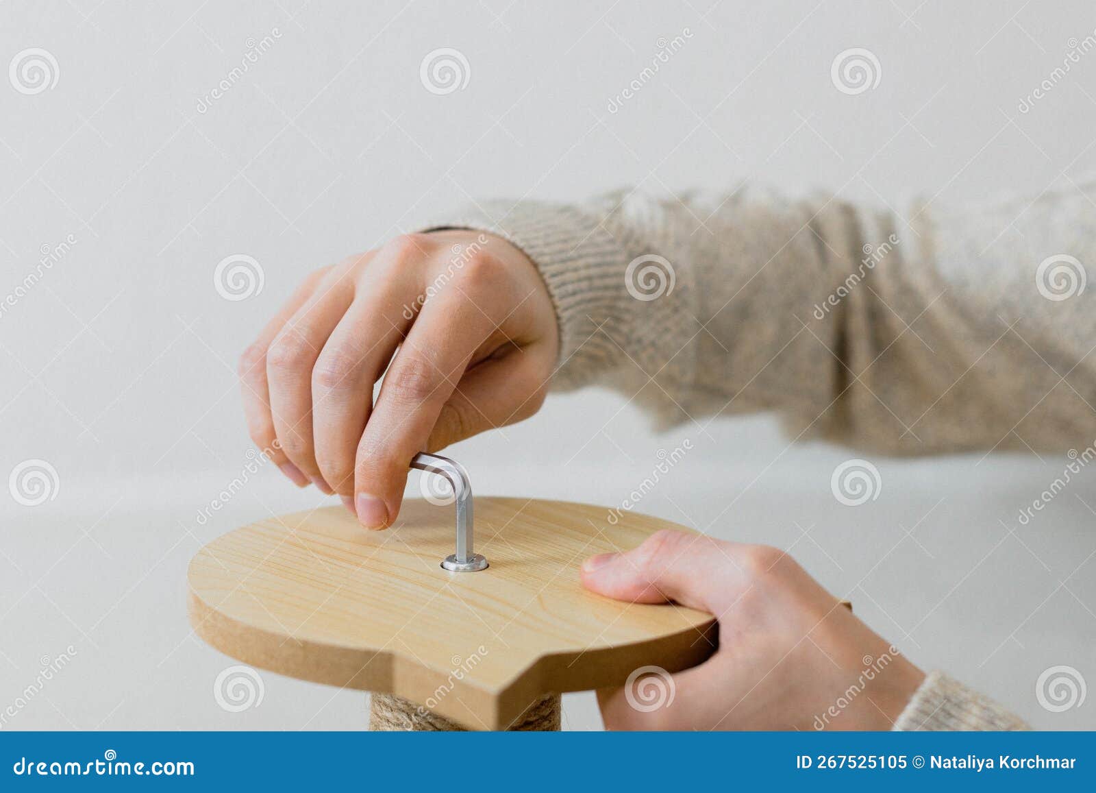 A Young Man is Screwing a Bolt into a Board. Stock Image - Image of ...