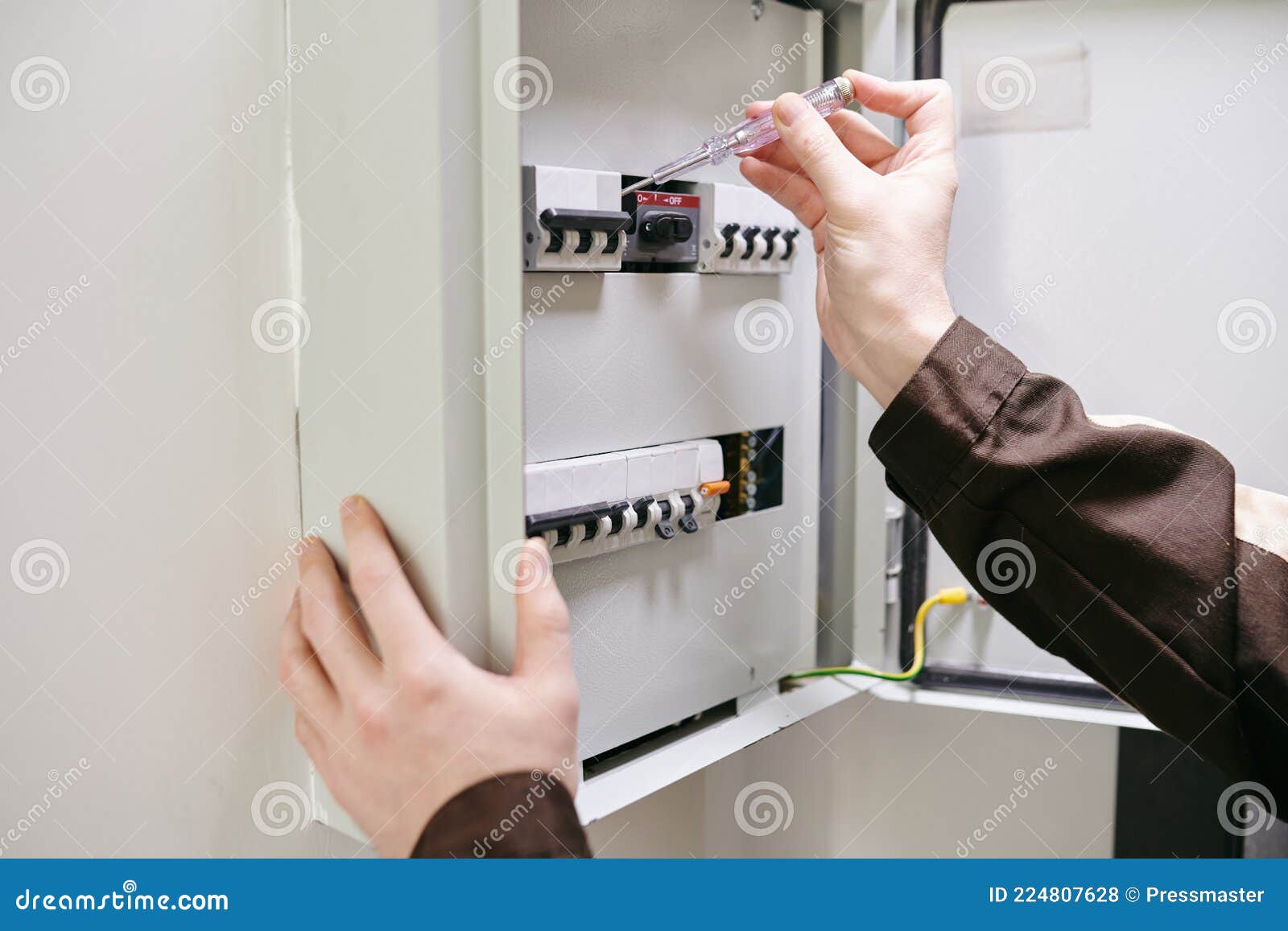 Hands of Young Electrician Using Current Measuring Tool Stock Photo ...