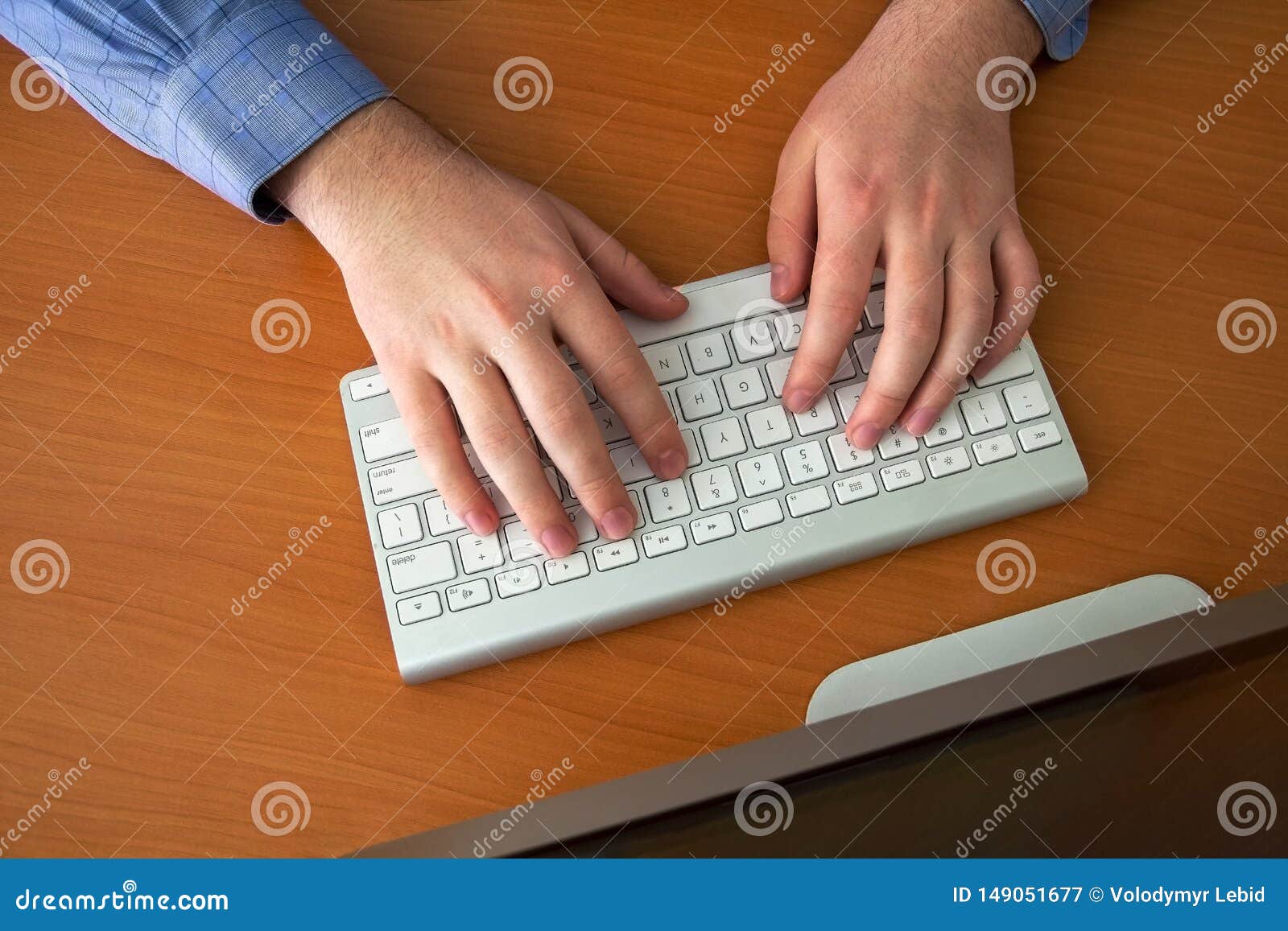 Hands of a Young Man on a Computer Keyboard, Top View. the Concept of ...