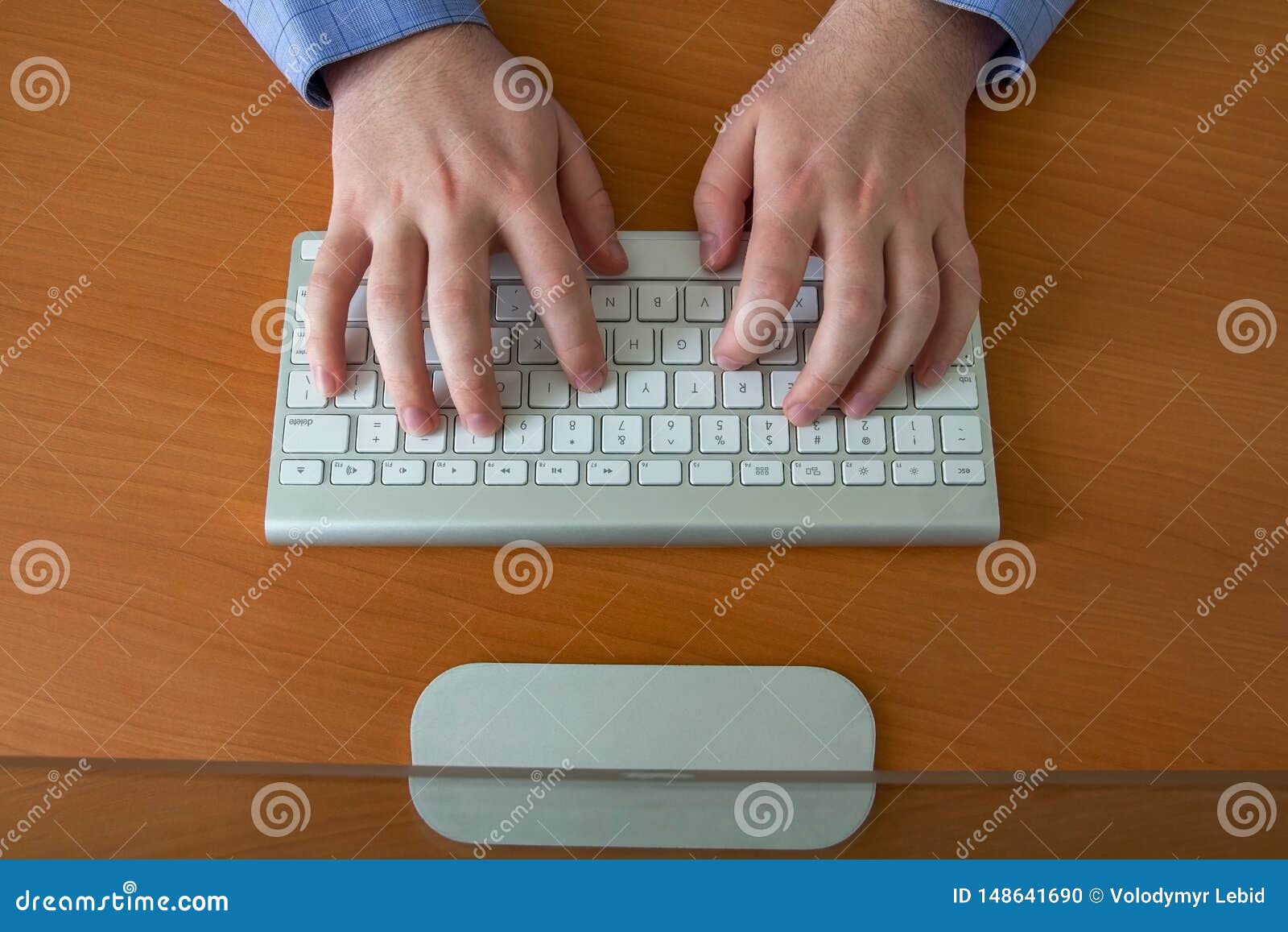 Hands of a Young Man on a Computer Keyboard, Top View. the Concept of ...